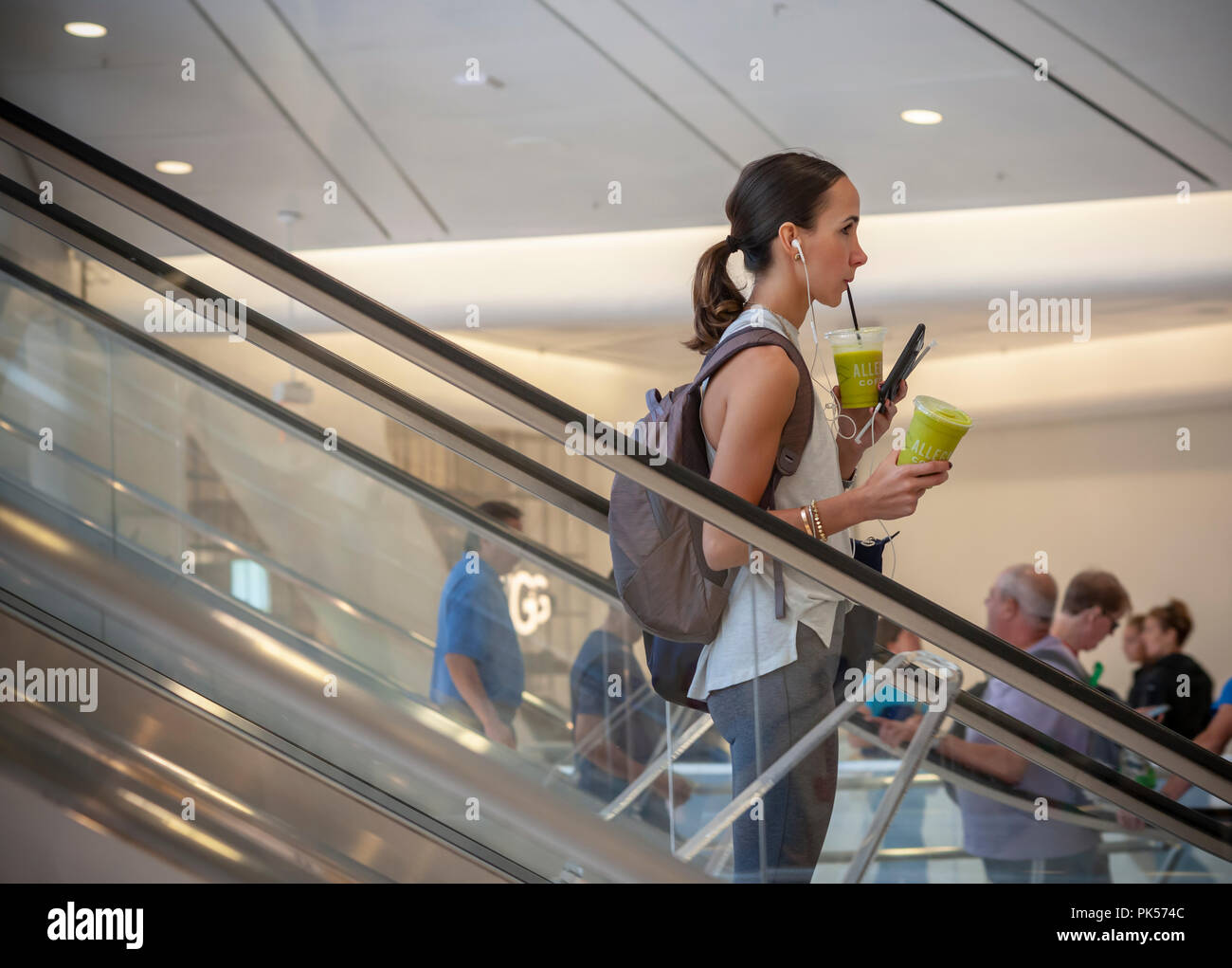 A millennial woman rides the escalator in the Oculus World Trade Center ...