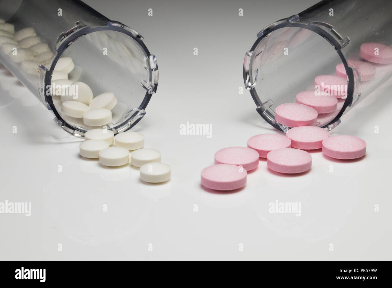 Pink and White prescription pills and containers. Drugs for sick ...