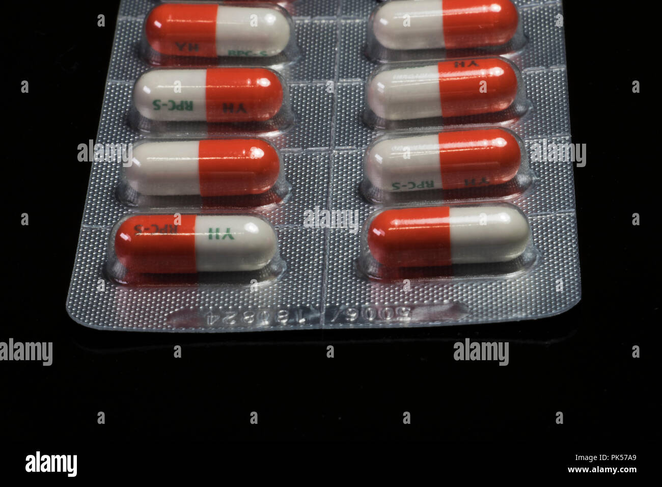 Close up of prescription medicine. Pill packaging isolated on black ...