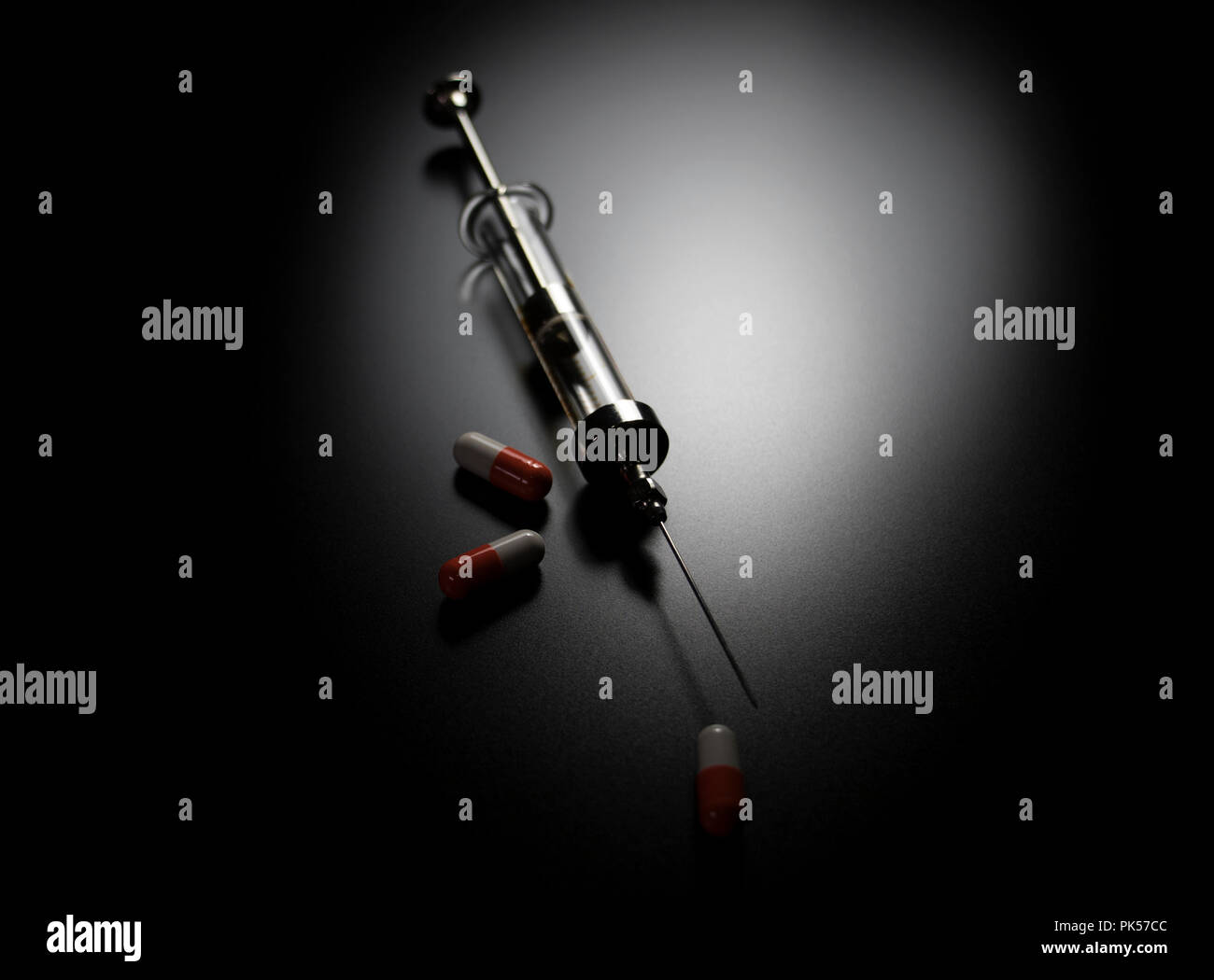 Syringe and Pills. Glass needle and two color capsules. Medicine. Nurse ...