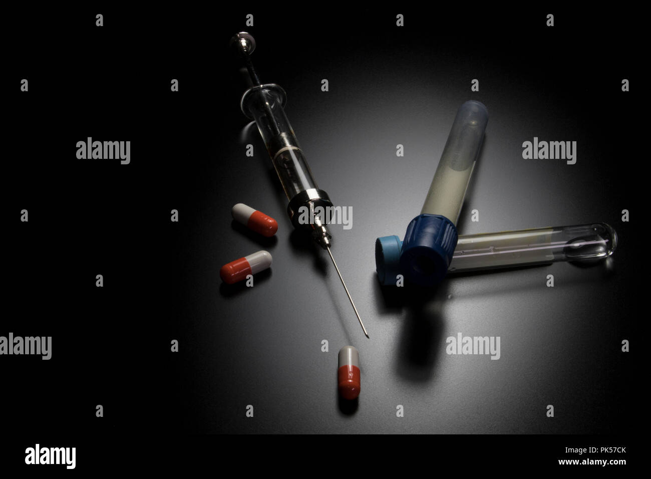 Needles, Vials and pills. Pharmaceutical cancer products for the heath ...