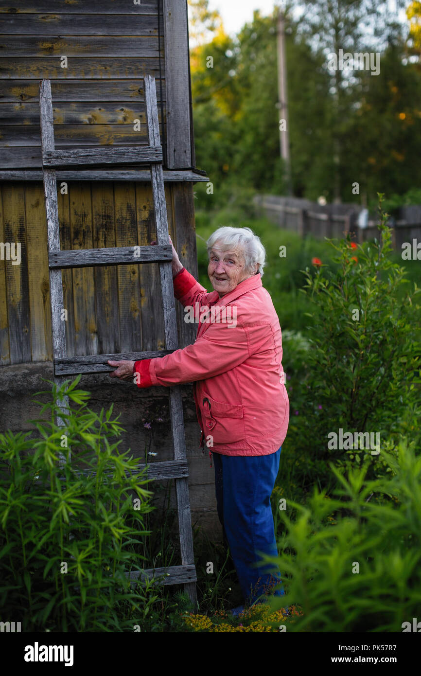 Beautiful older woman stands hi-res stock photography and images - Alamy