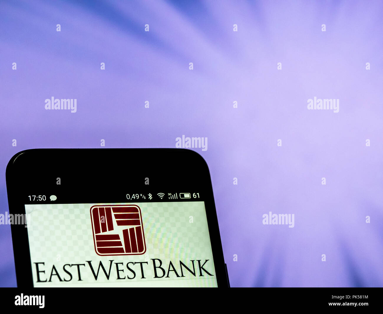 East West Bank logo seen displayed on a smart phone Stock Photo - Alamy