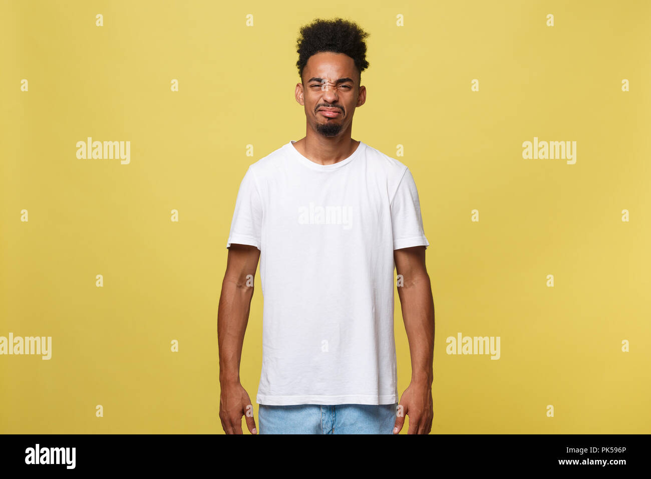 Portrait furious angry annoyed displeased young man raising hands up to ...
