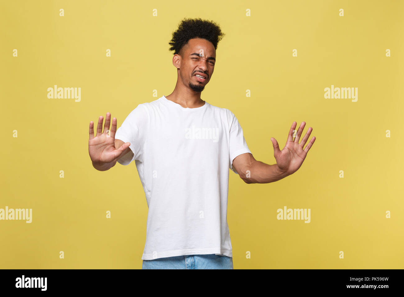 Portrait furious angry annoyed displeased young man raising hands up to ...