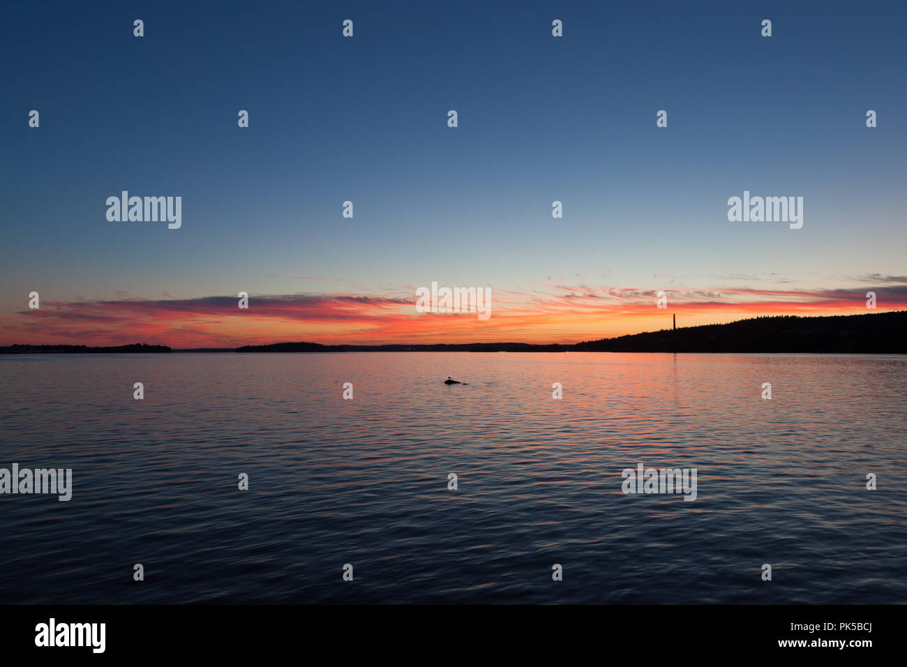 Calm sunset and clouds over lake Stock Photo - Alamy