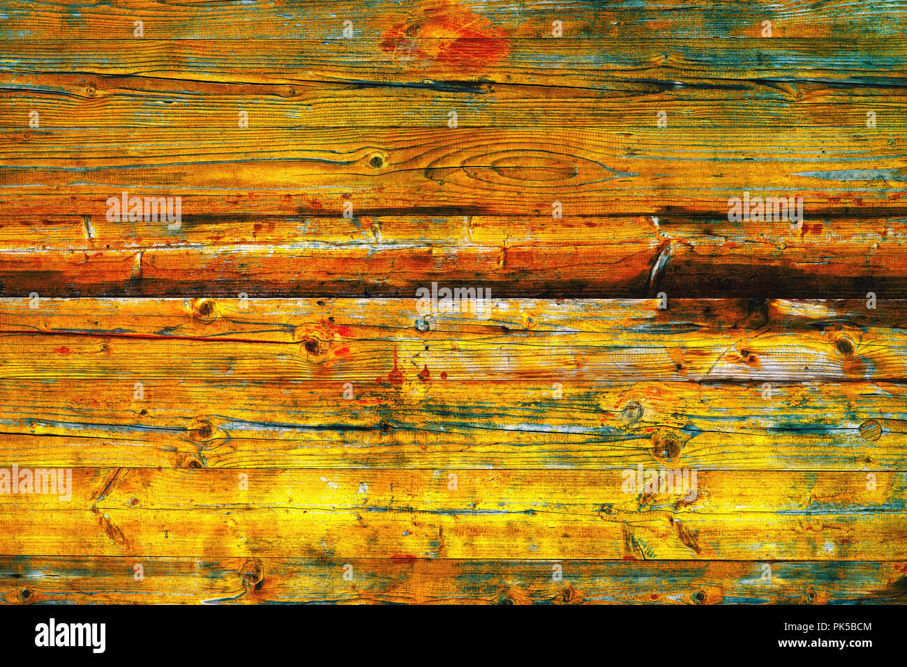 Yellow weather worn wooden planks surface as background, rough ...