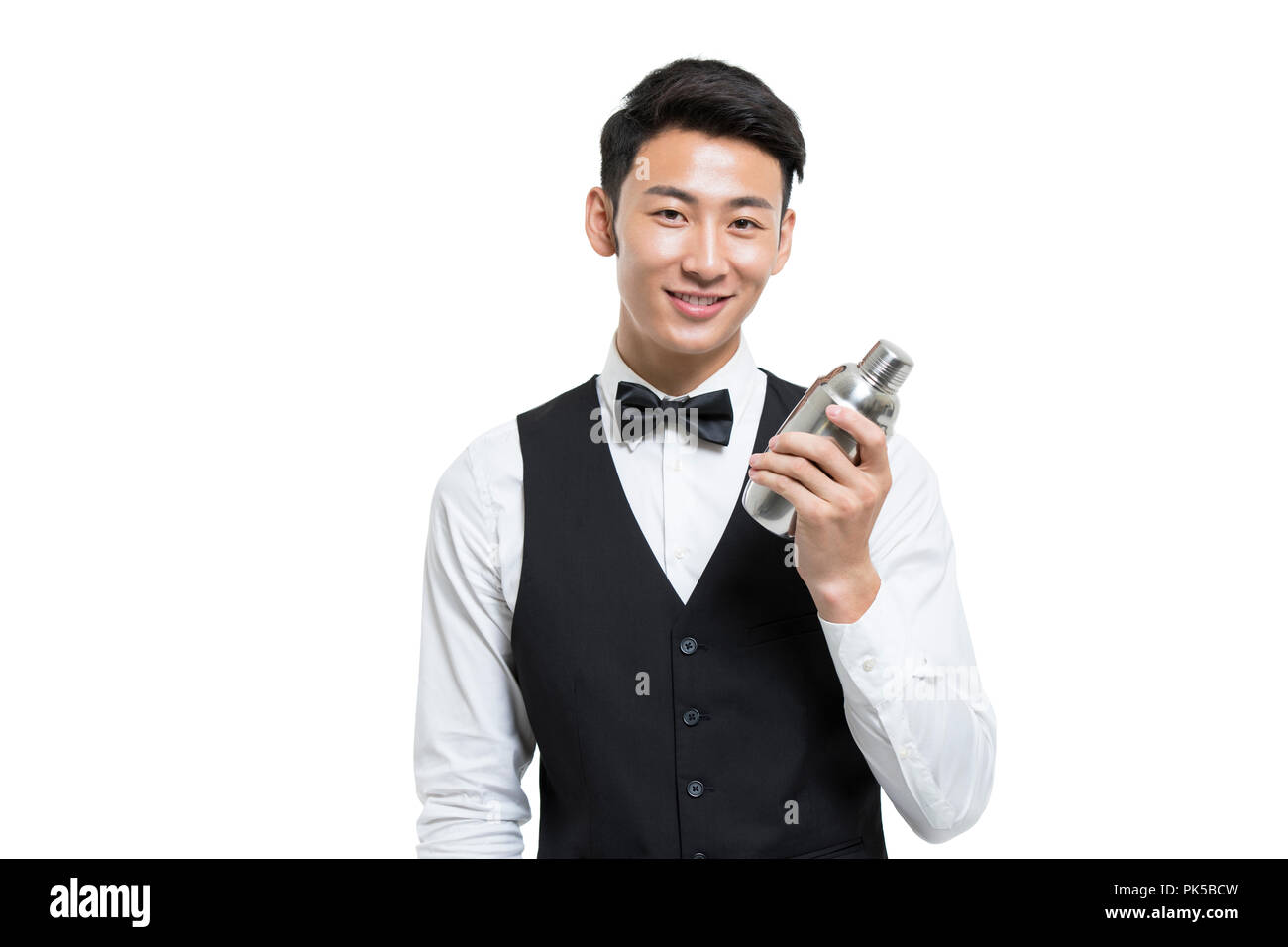 Cheerful young bartender shaking drinks Stock Photo - Alamy