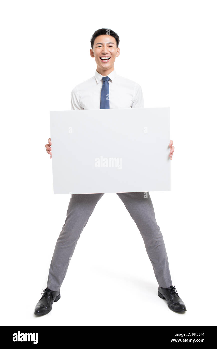 Cheerful young businessman showing a whiteboard Stock Photo - Alamy