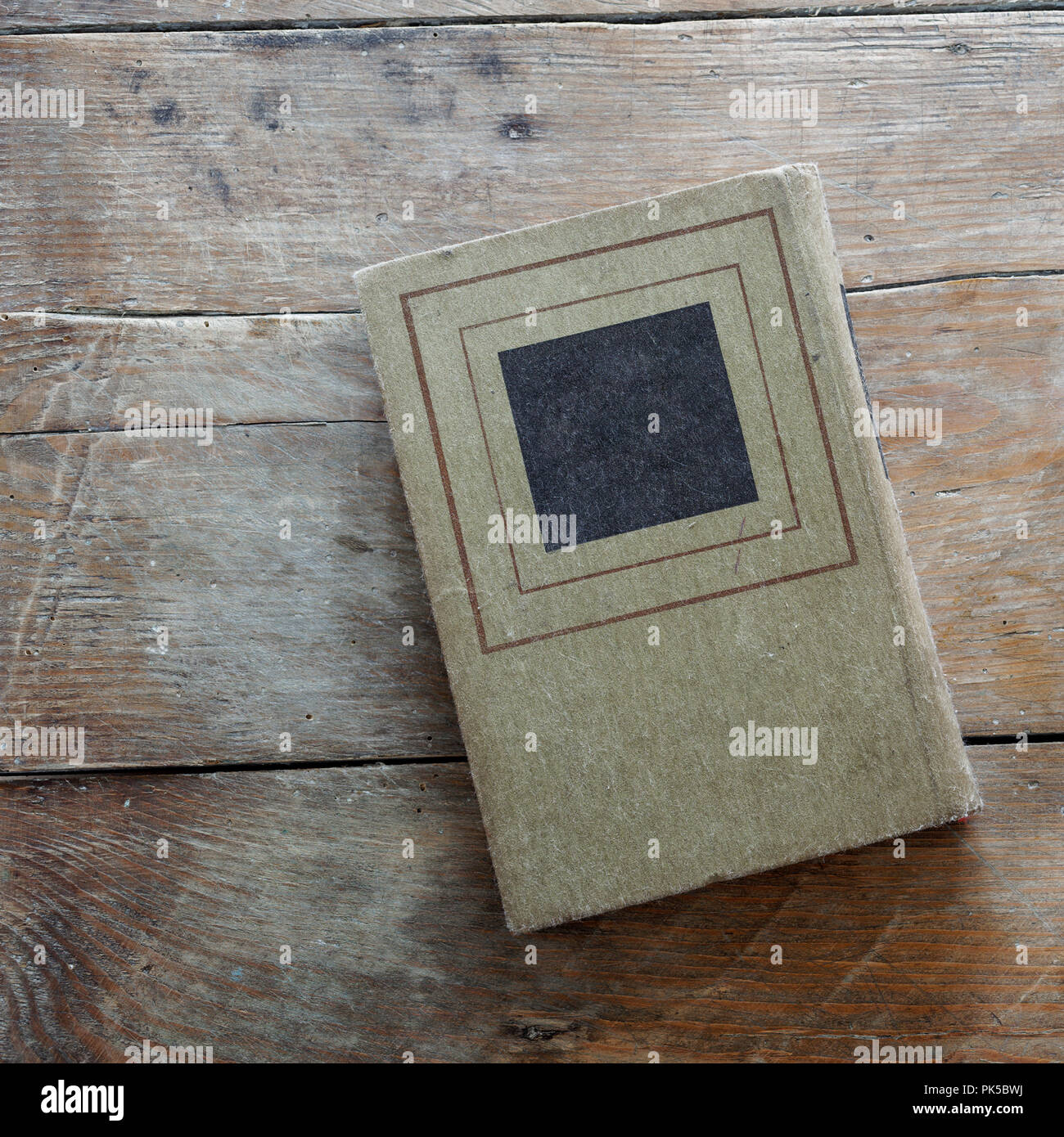 Vintage book on wooden table top view Stock Photo - Alamy