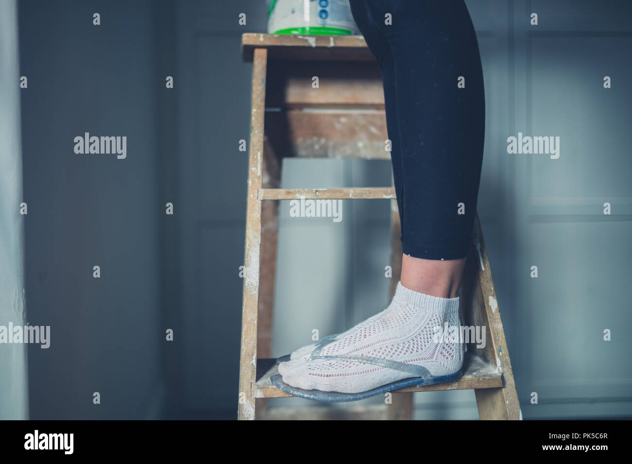 Feet on ladder woman hi-res stock photography and images - Alamy