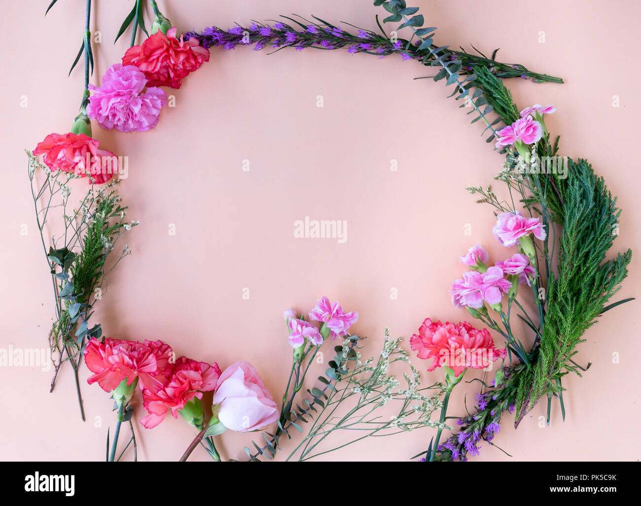Minimal flat lay Frame with fresh flowers Stock Photo - Alamy
