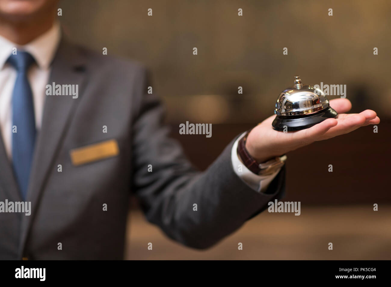 Hotel bell one hand hi-res stock photography and images - Alamy