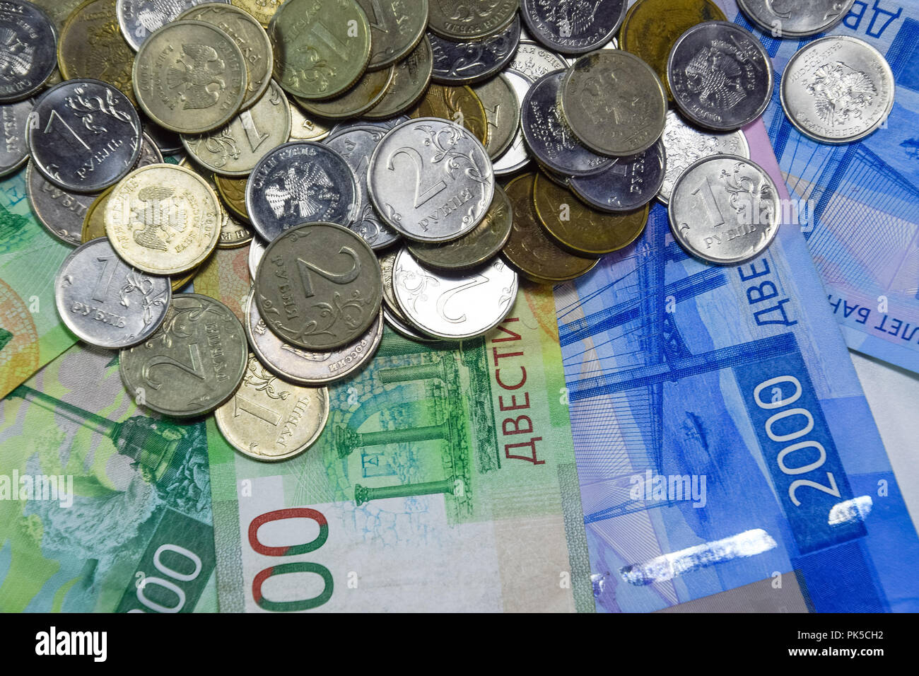 Russian banknotes and coins. A handful of coins on new Russian ...