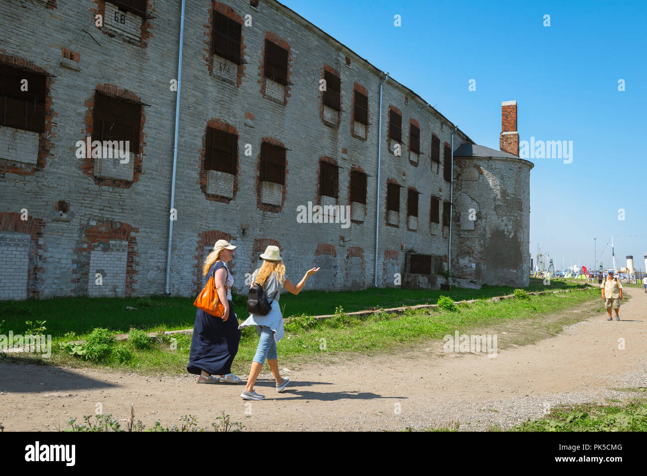Patarei Prison, on a summer afternoon two young women walk past the ...