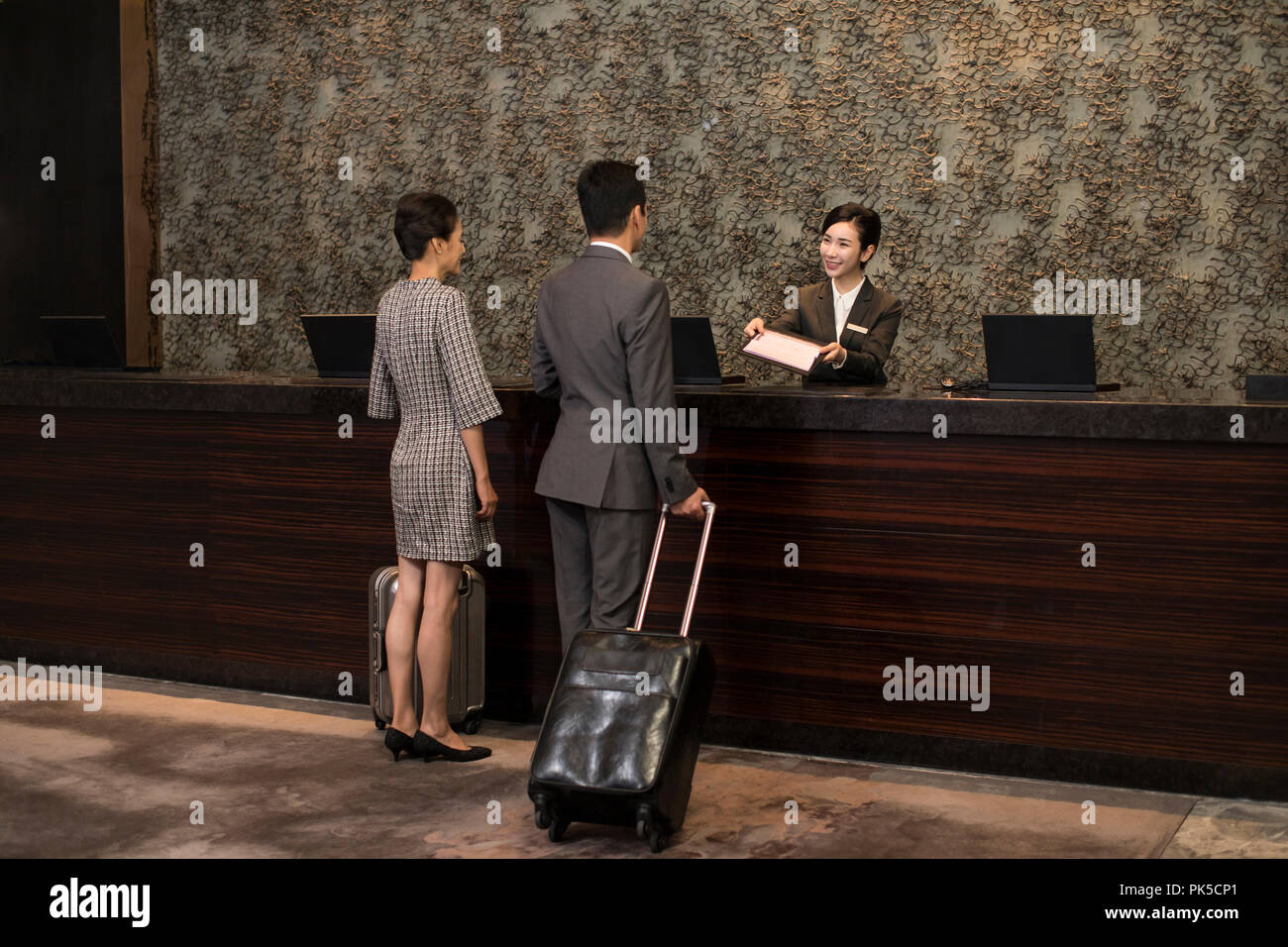Mature couple hotel reception hi-res stock photography and images - Alamy