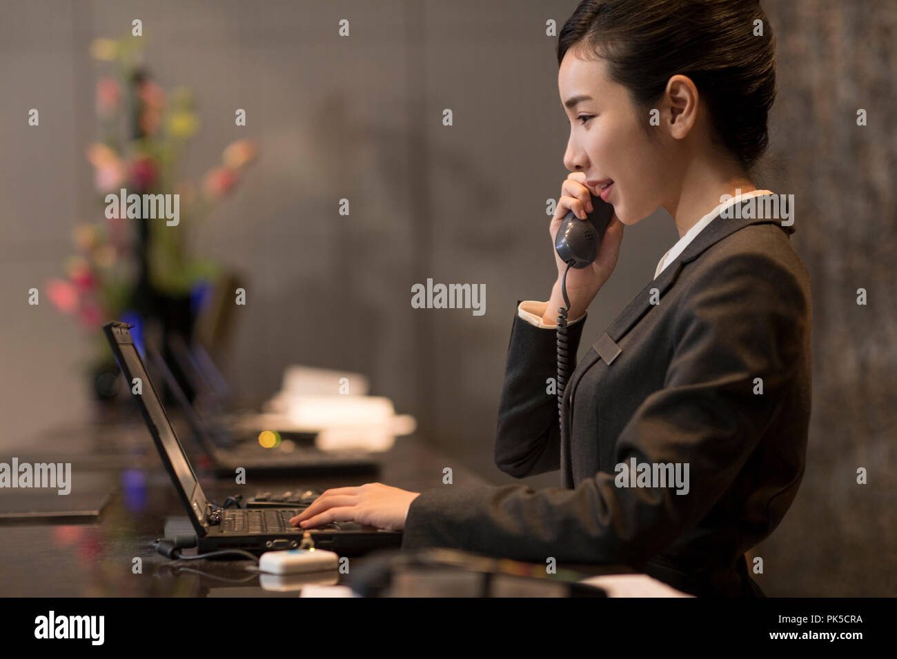 Receptionist phone multi not headset hi-res stock photography and ...