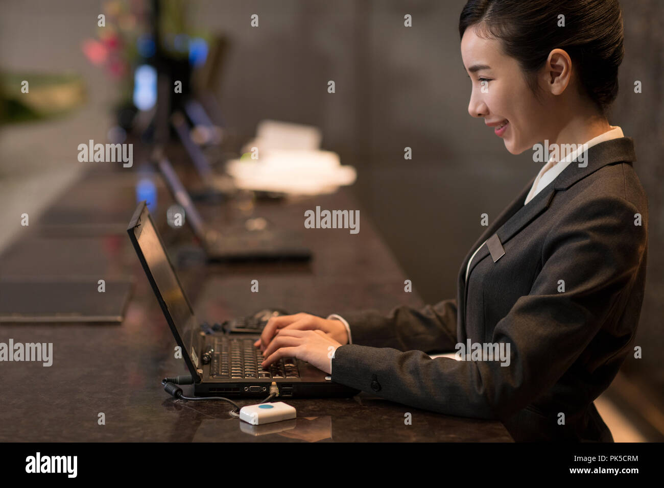 Asia Hotel Receptionist High Resolution Stock Photography and Images - Alamy