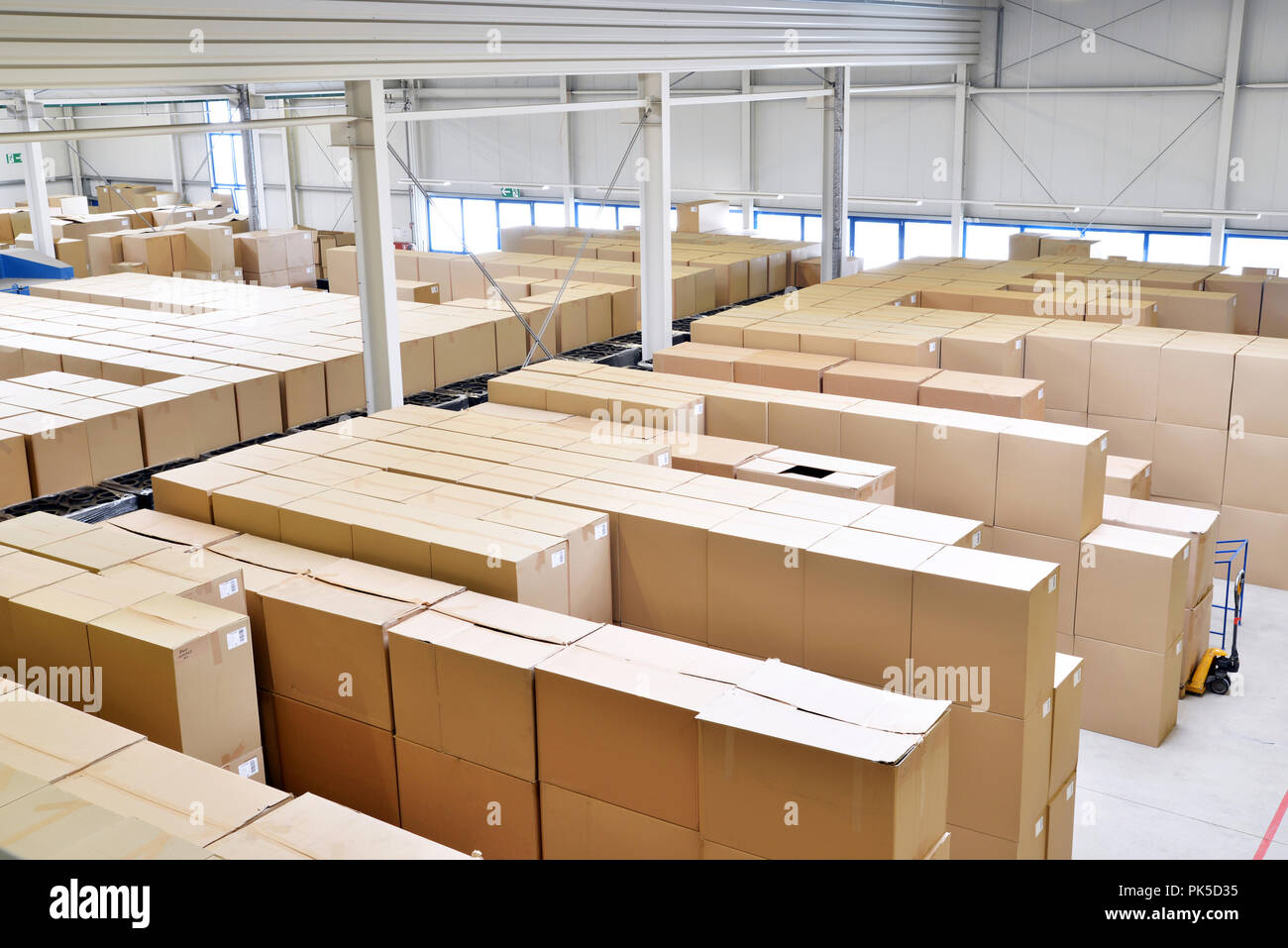 storage of cardboard boxes in a large warehouse of an industrial ...