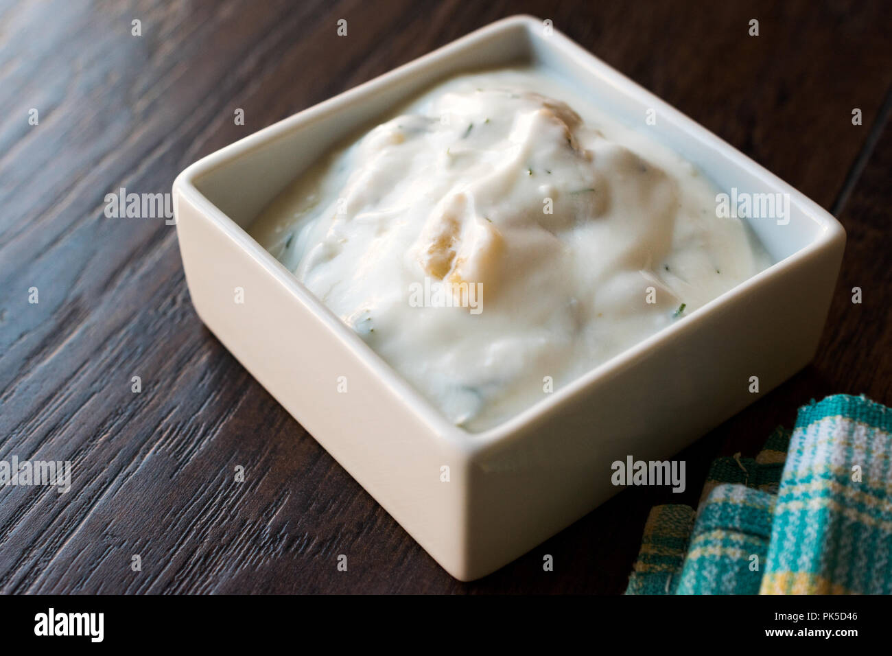 Turkish Appetizer Haydari with yogurt (Tzatziki) in square ceramic bowl ...