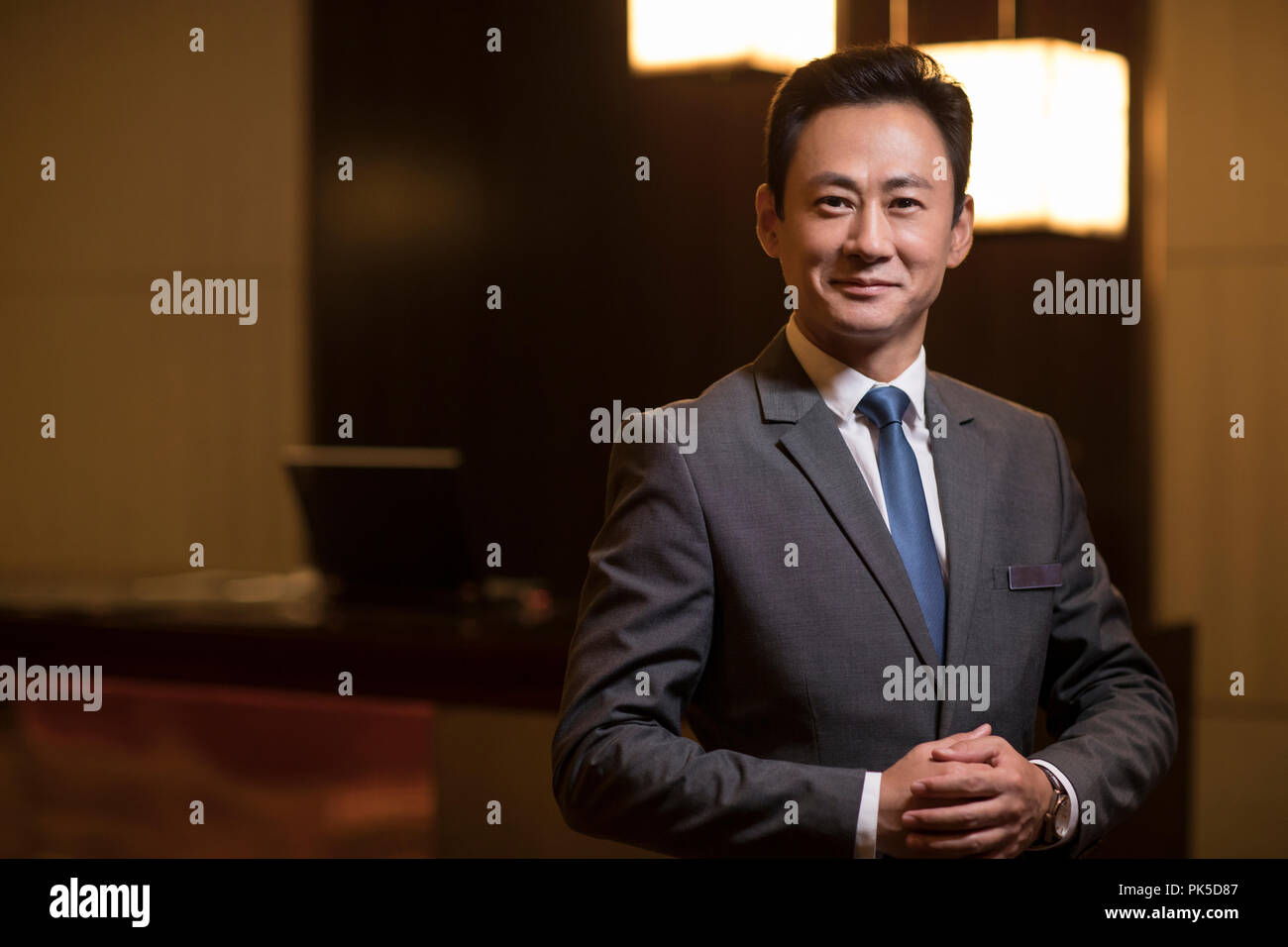 Portrait of confident hotel manager Stock Photo - Alamy