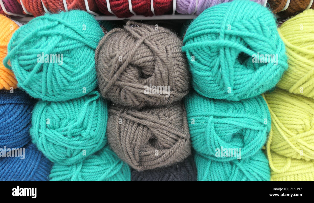Colored wool yarn balls in a shop Stock Photo - Alamy