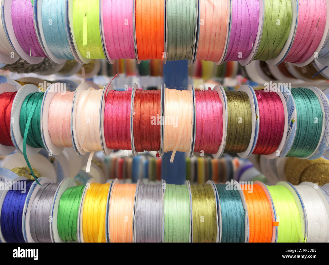 Colorful ropes on bobbins Stock Photo - Alamy