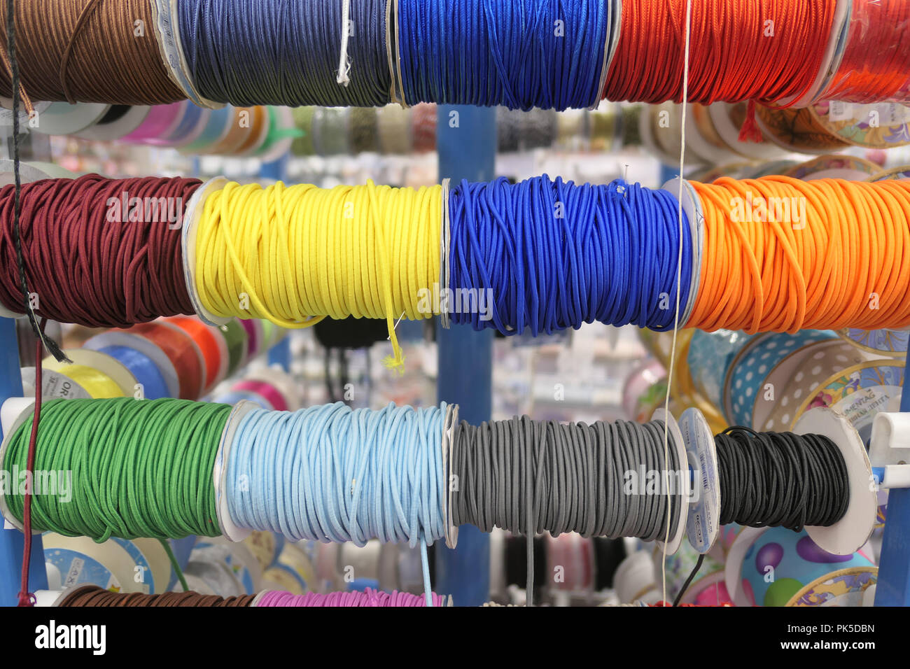 Colorful ropes on bobbins Stock Photo - Alamy