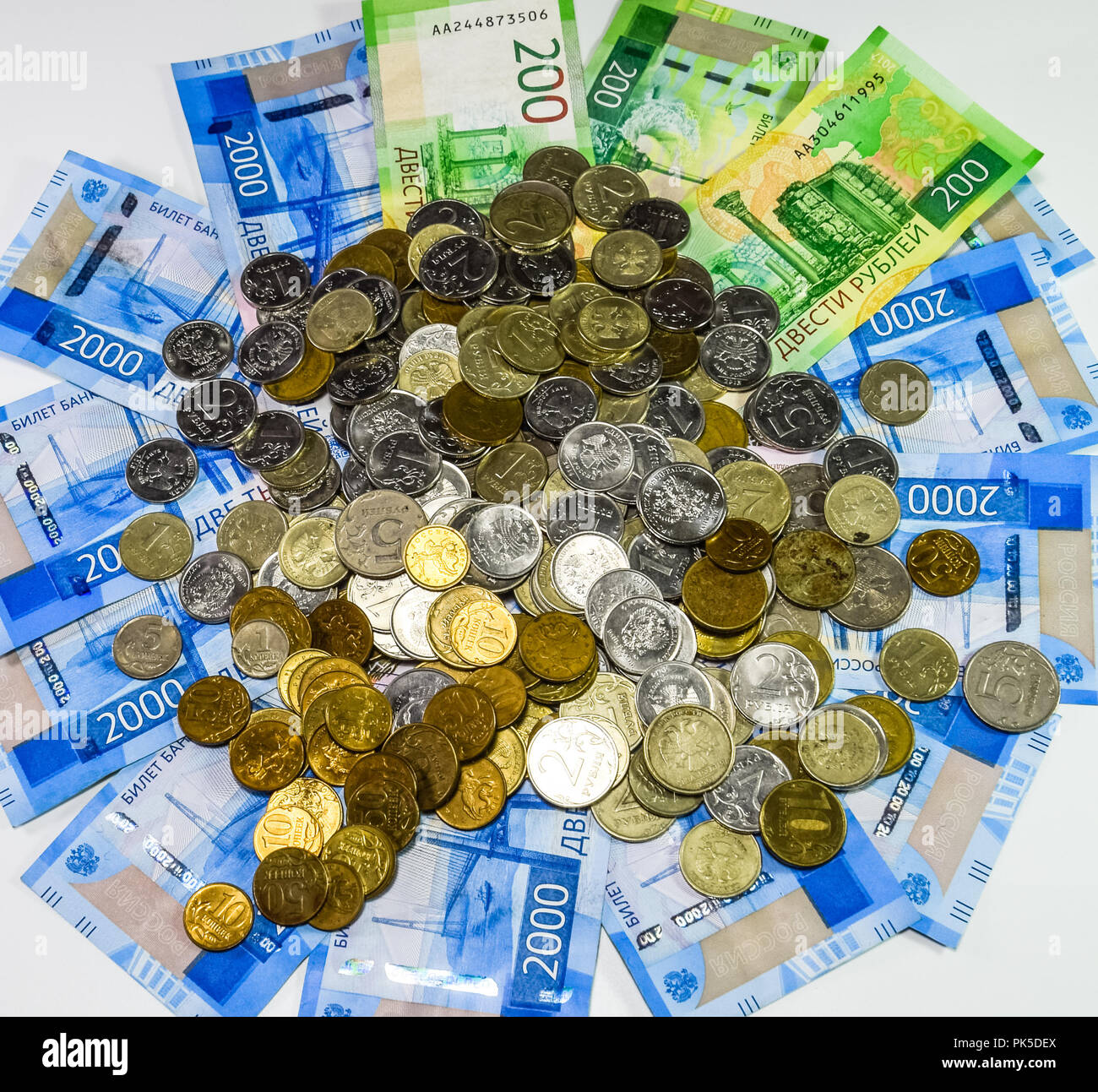 Russian banknotes and coins. A handful of coins on new Russian ...