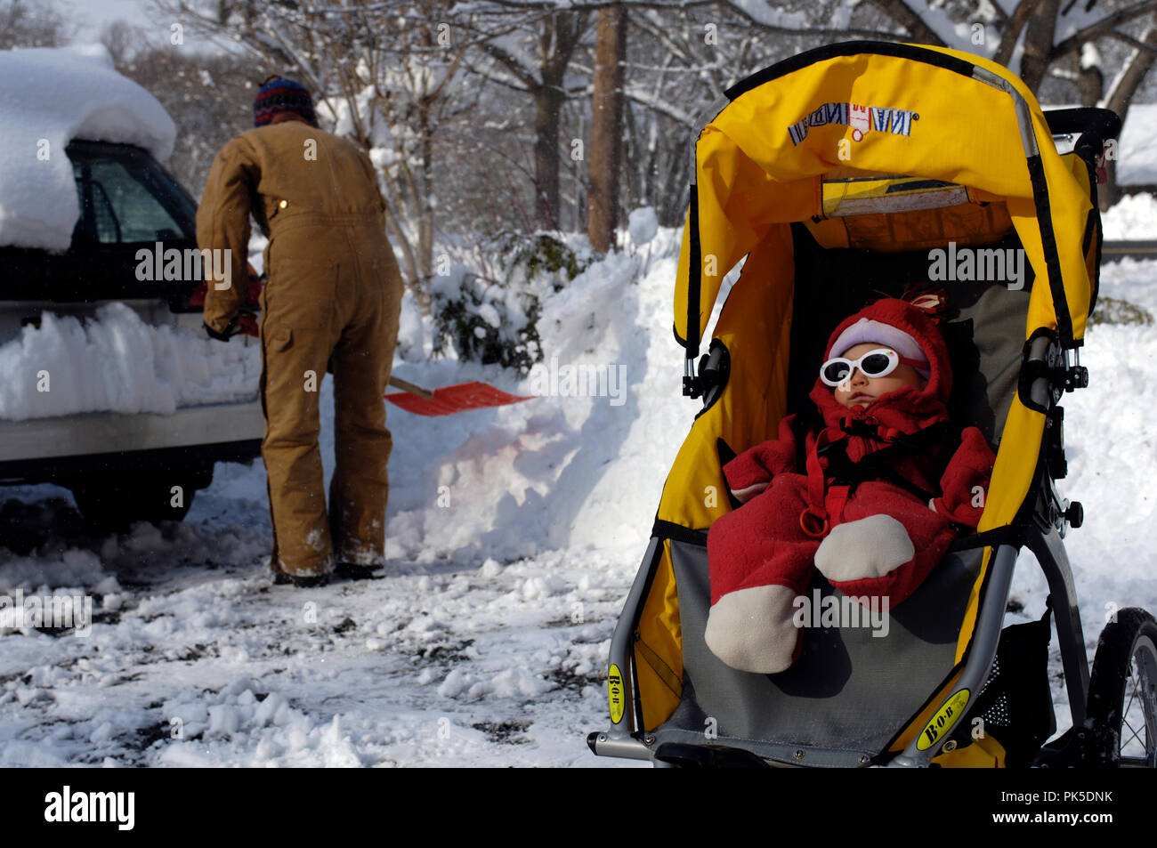 Dawn Graham and her daughter Lizzy work at shoveling the record snow ...