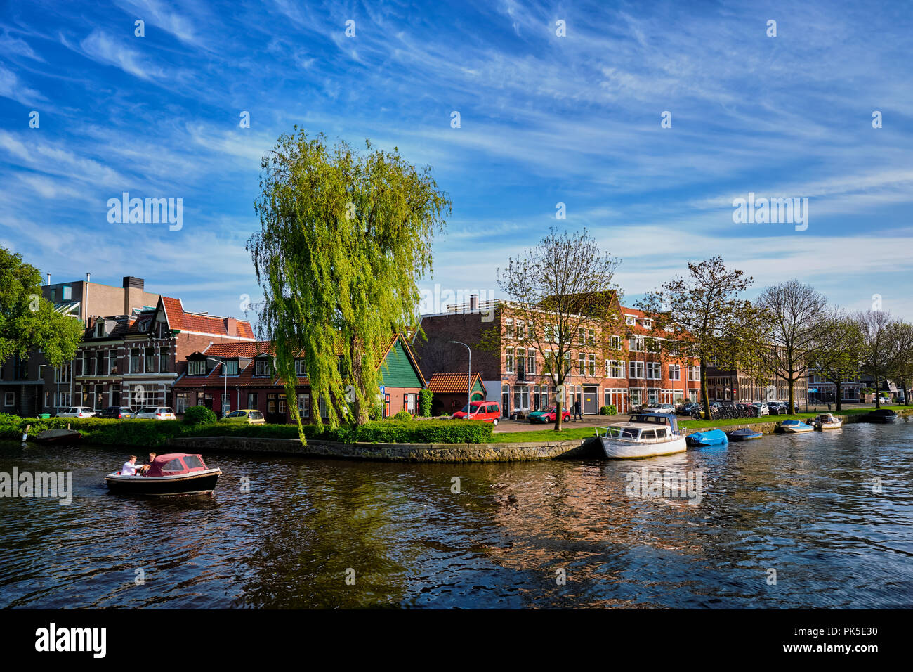 Boats, houses and canal. Harlem, Netherlands Stock Photo - Alamy