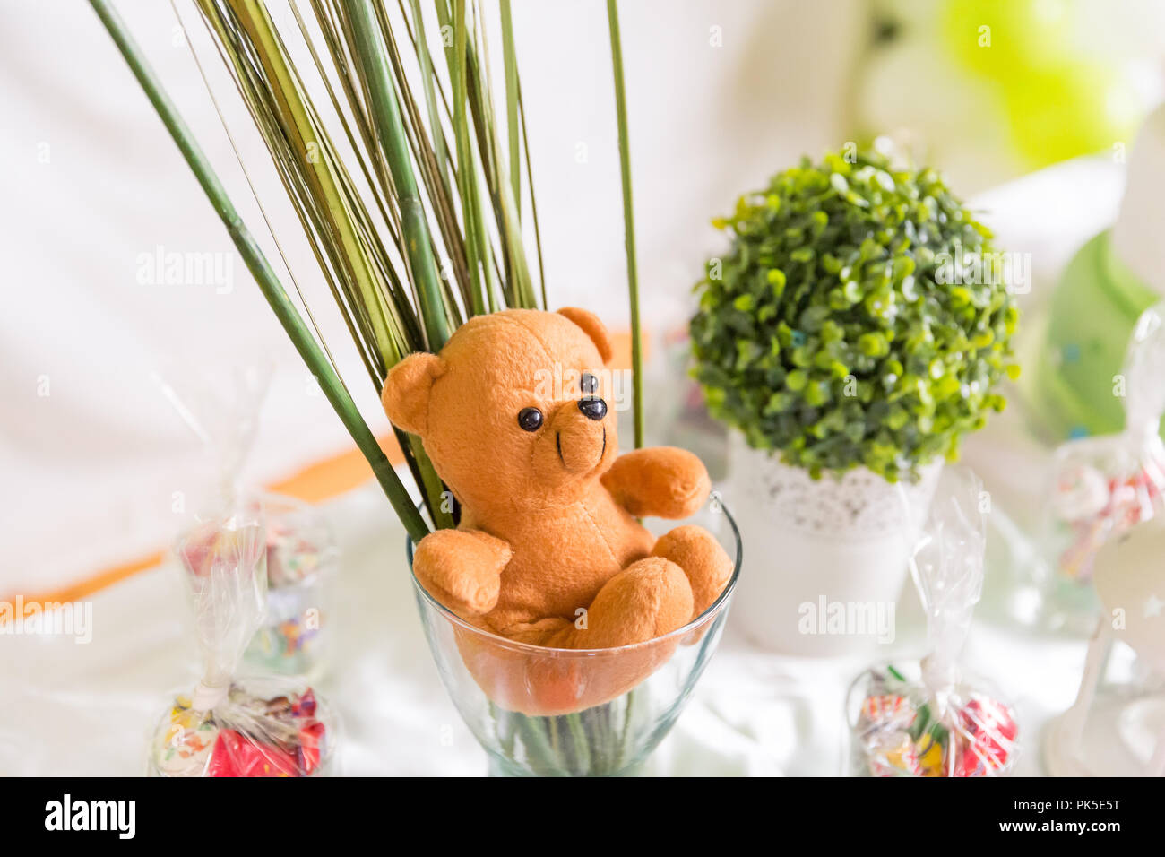Teddy Bear in a Glass Cup with Green and White Birthday Table ...