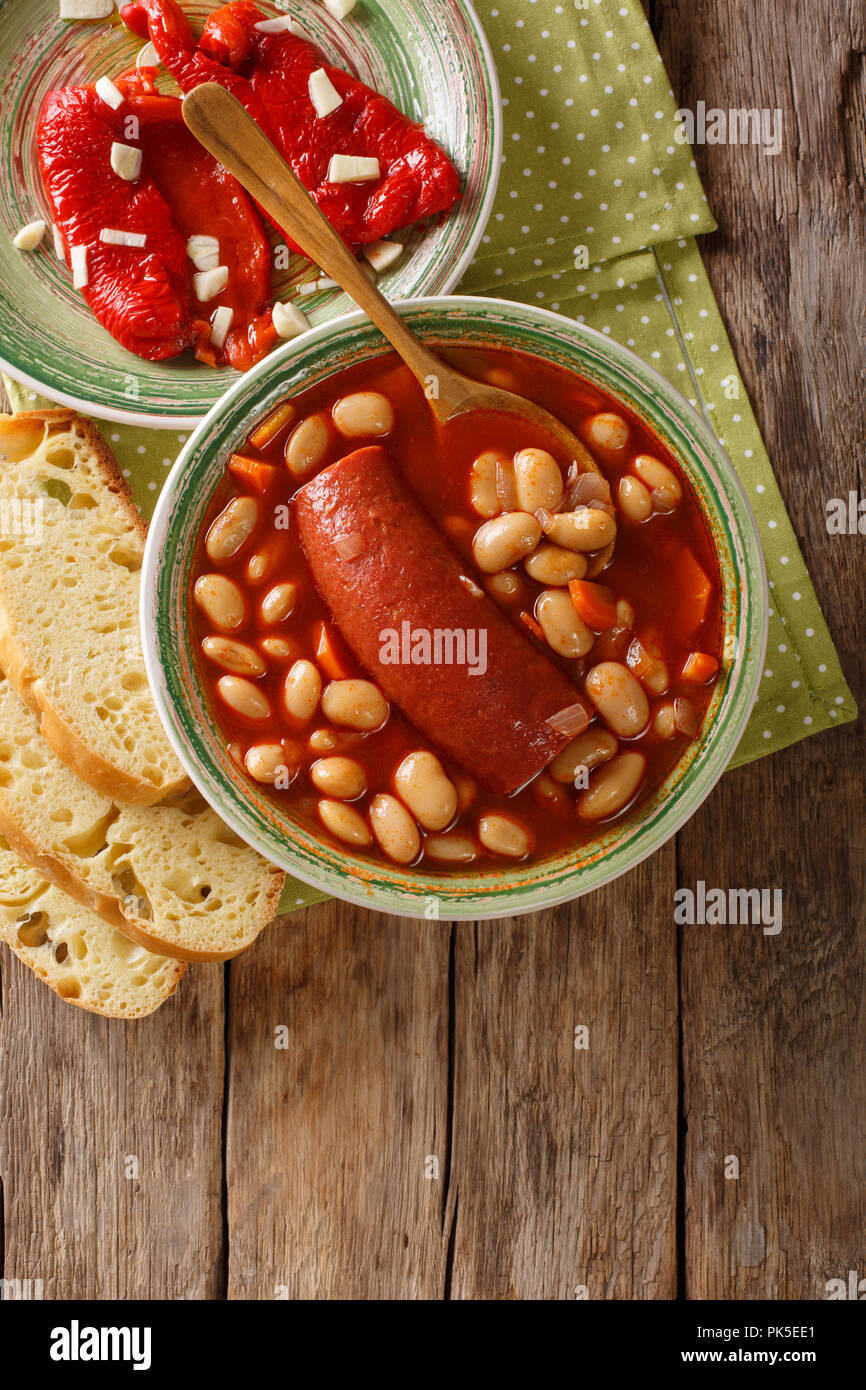 Traditional Balkan food: pasulj bean soup with sausage close-up on a ...