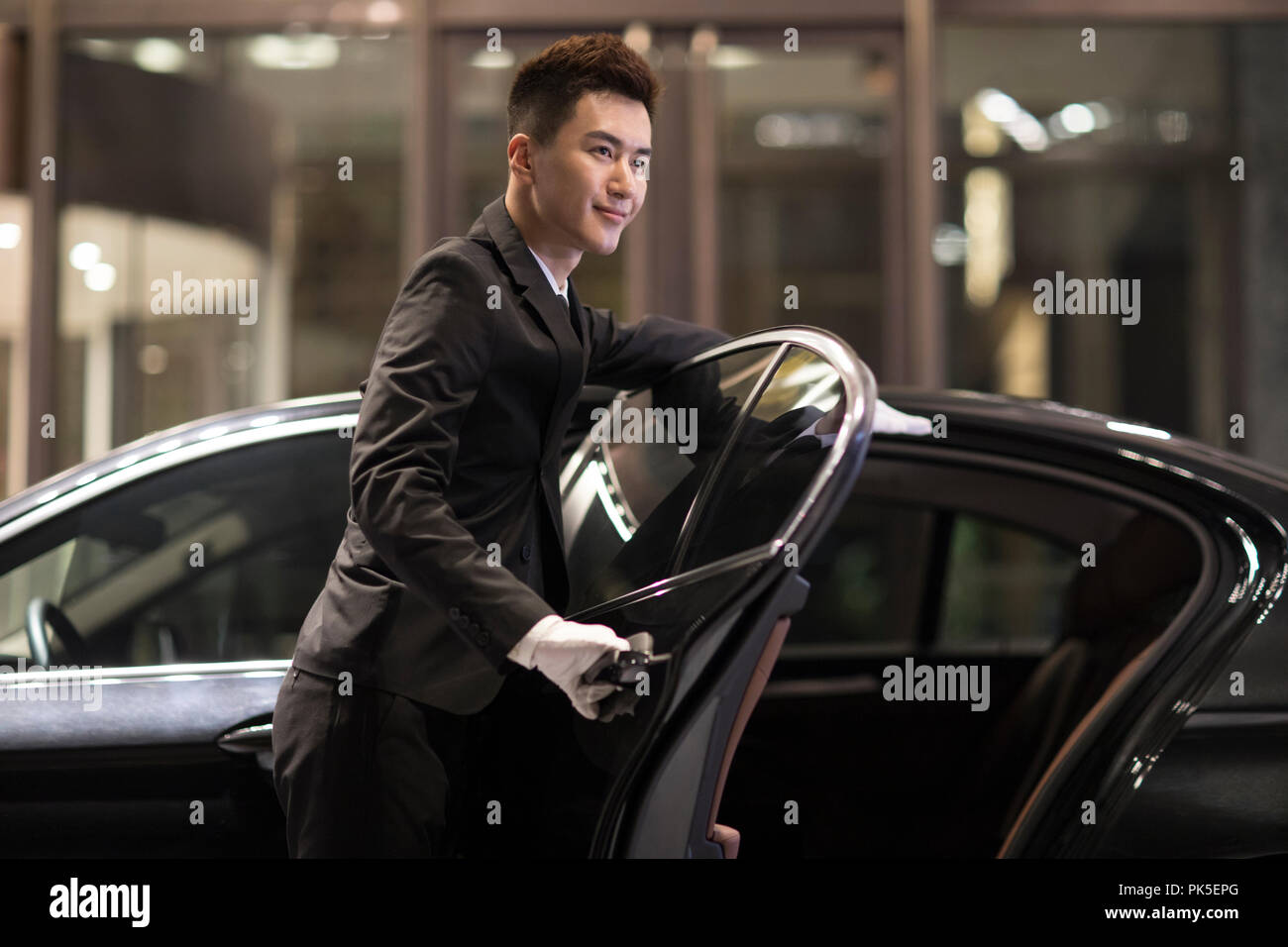 Man opening door back view hi-res stock photography and images - Alamy