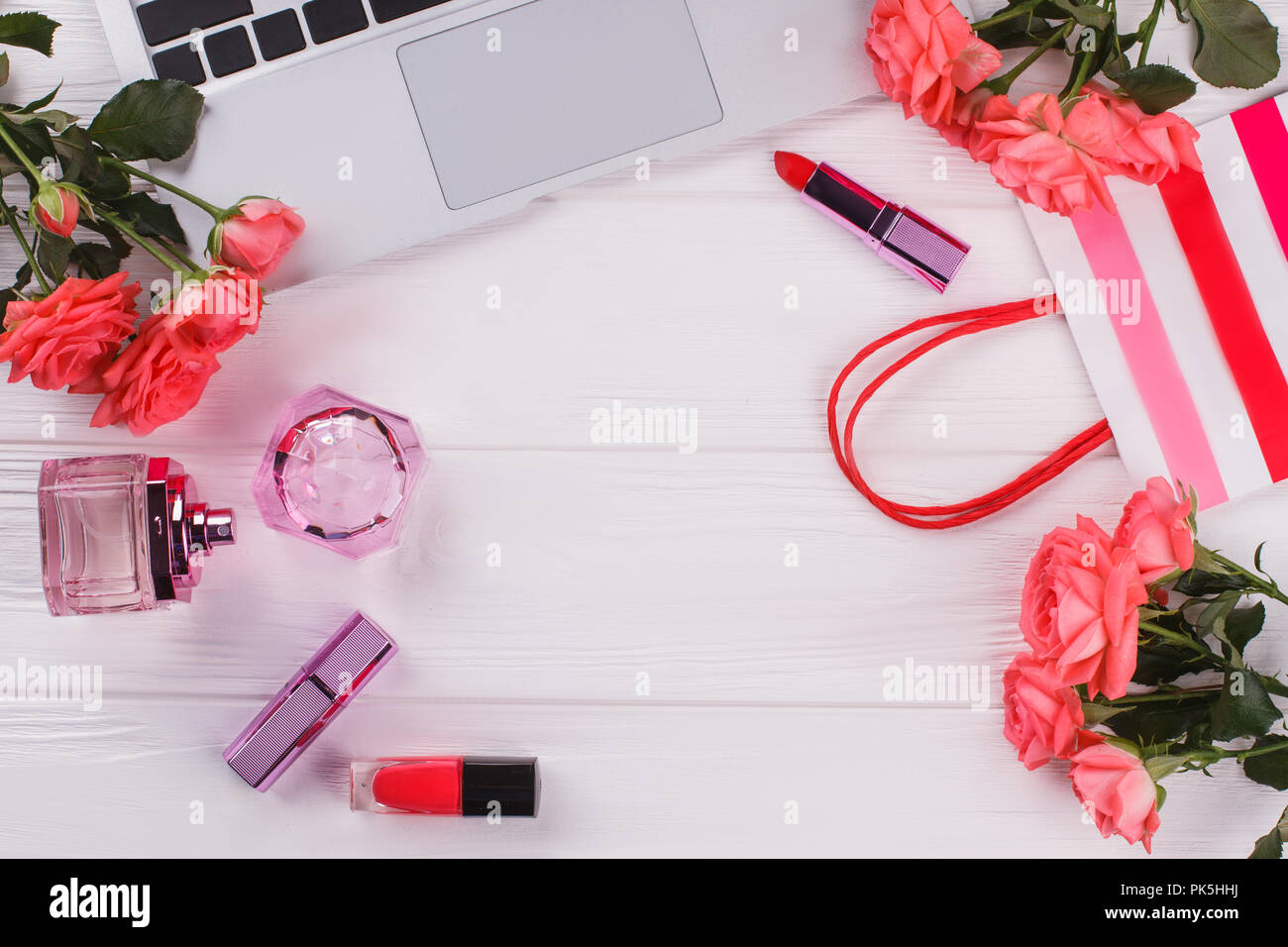 Womens belongings on white wood, flat lay. Top view. Items accessories ...