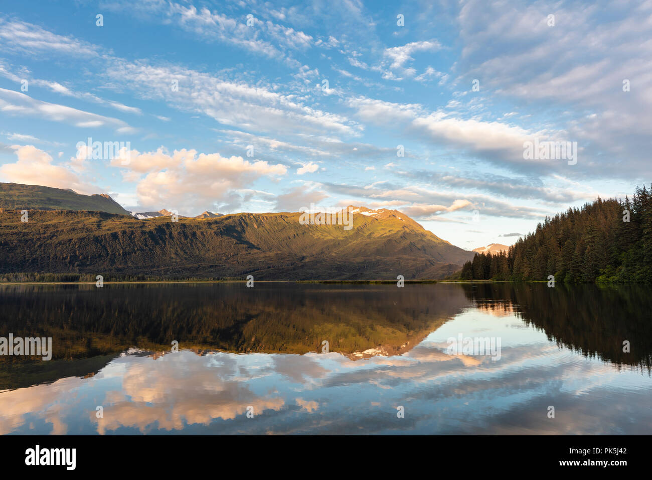Sunset light on Robe Lake and Chugach Mountains near Valdez in ...