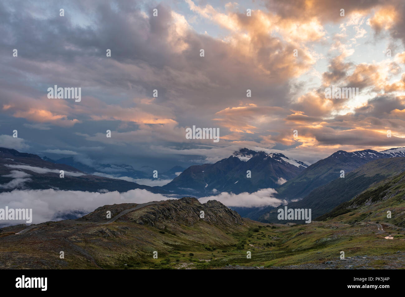 Sunset light on Hogback Glacier as storm clouds recede in Thompson Pass ...