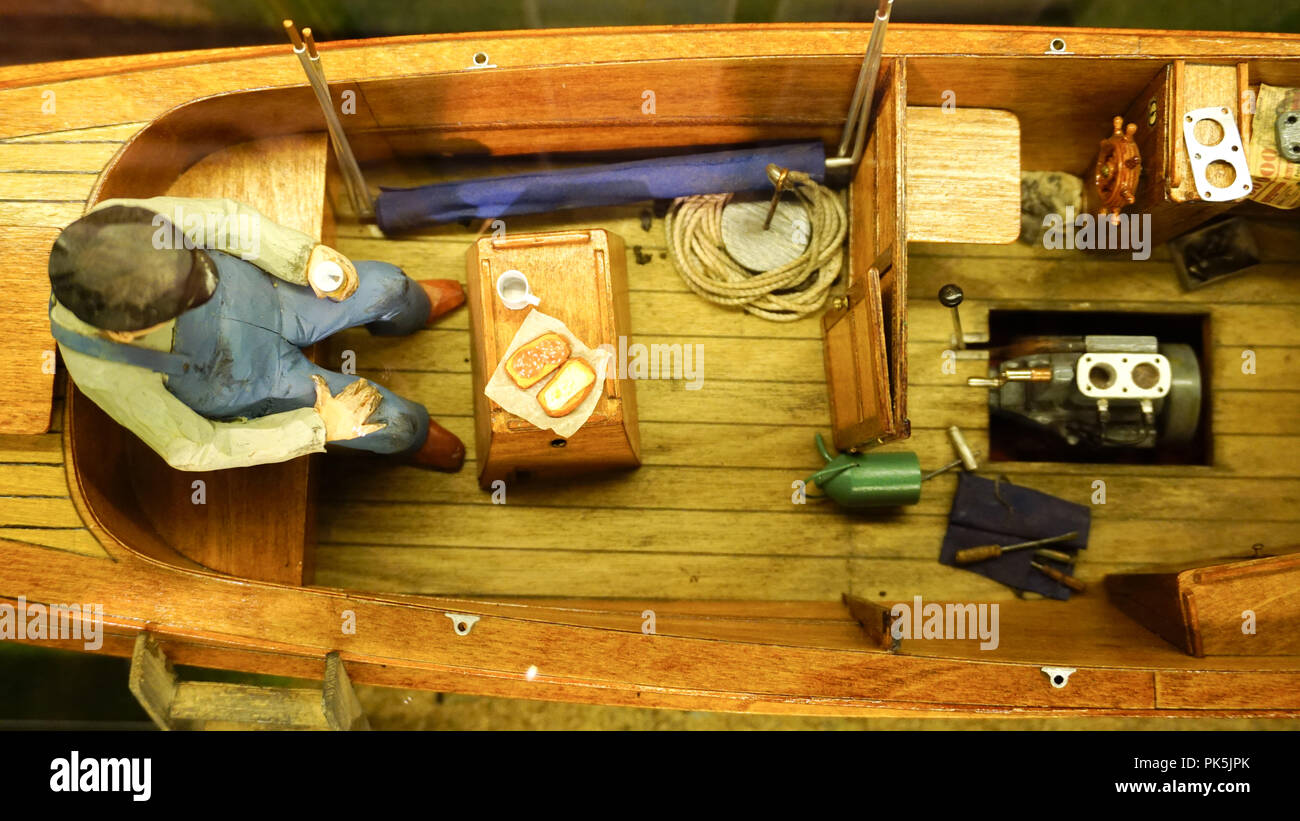 Miniature mini figure fisherman, eating on board and resting at fishing ...