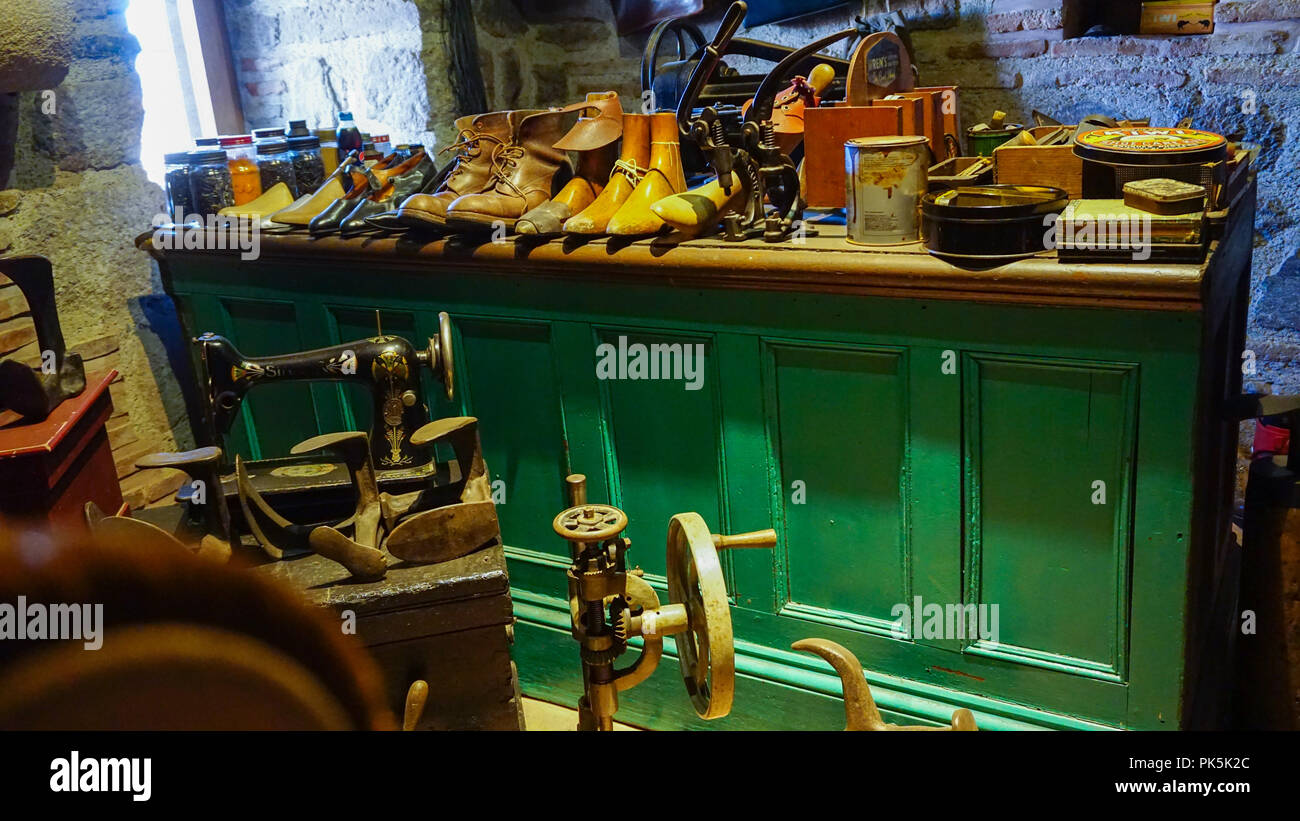 Old Shoe Workshop,shoe tools and different type shoes Stock Photo - Alamy