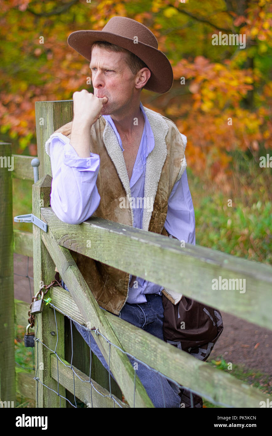 Man leaning against wooden fence hi-res stock photography and images ...