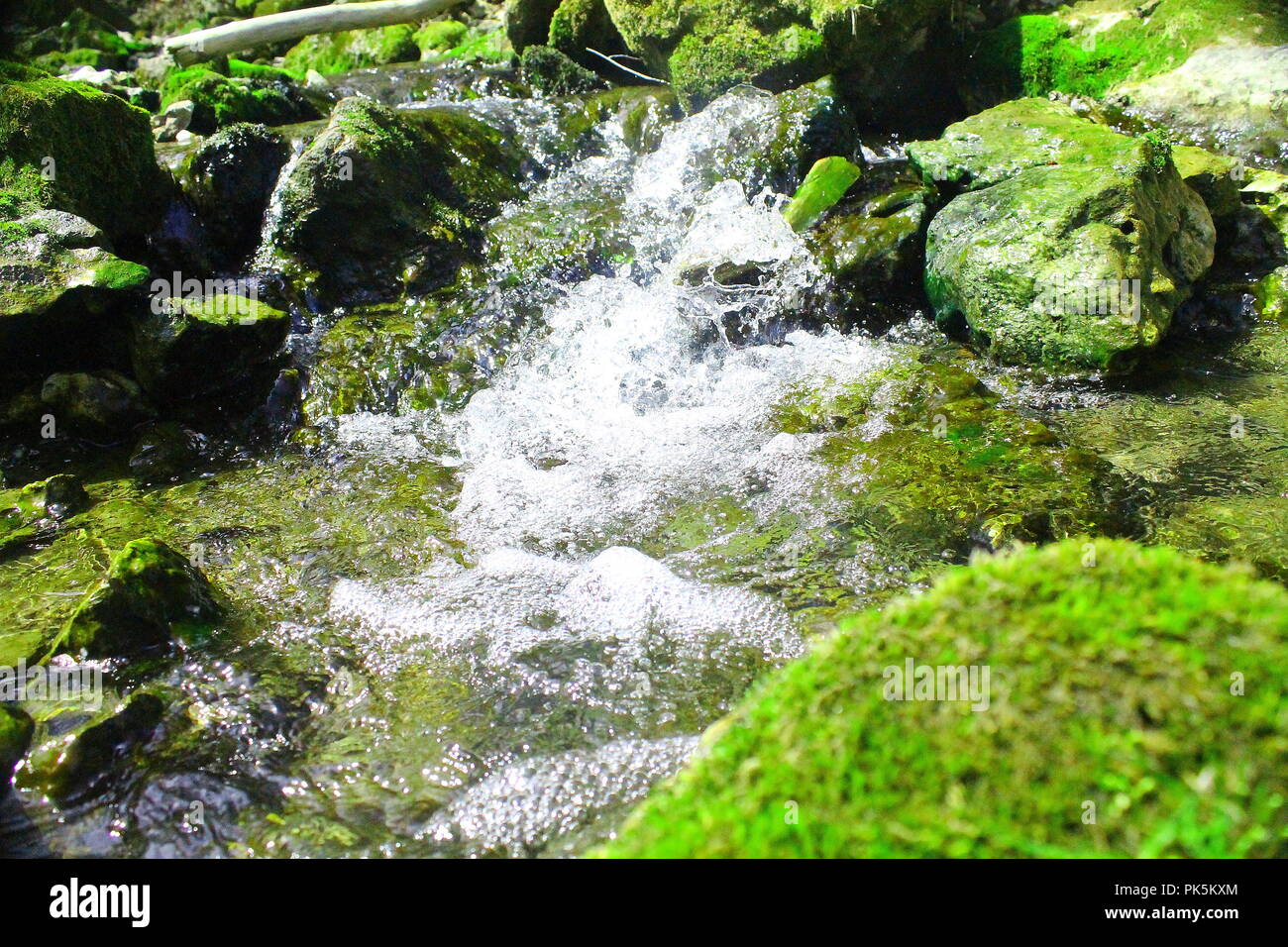 Water trickling over rock hi-res stock photography and images - Alamy