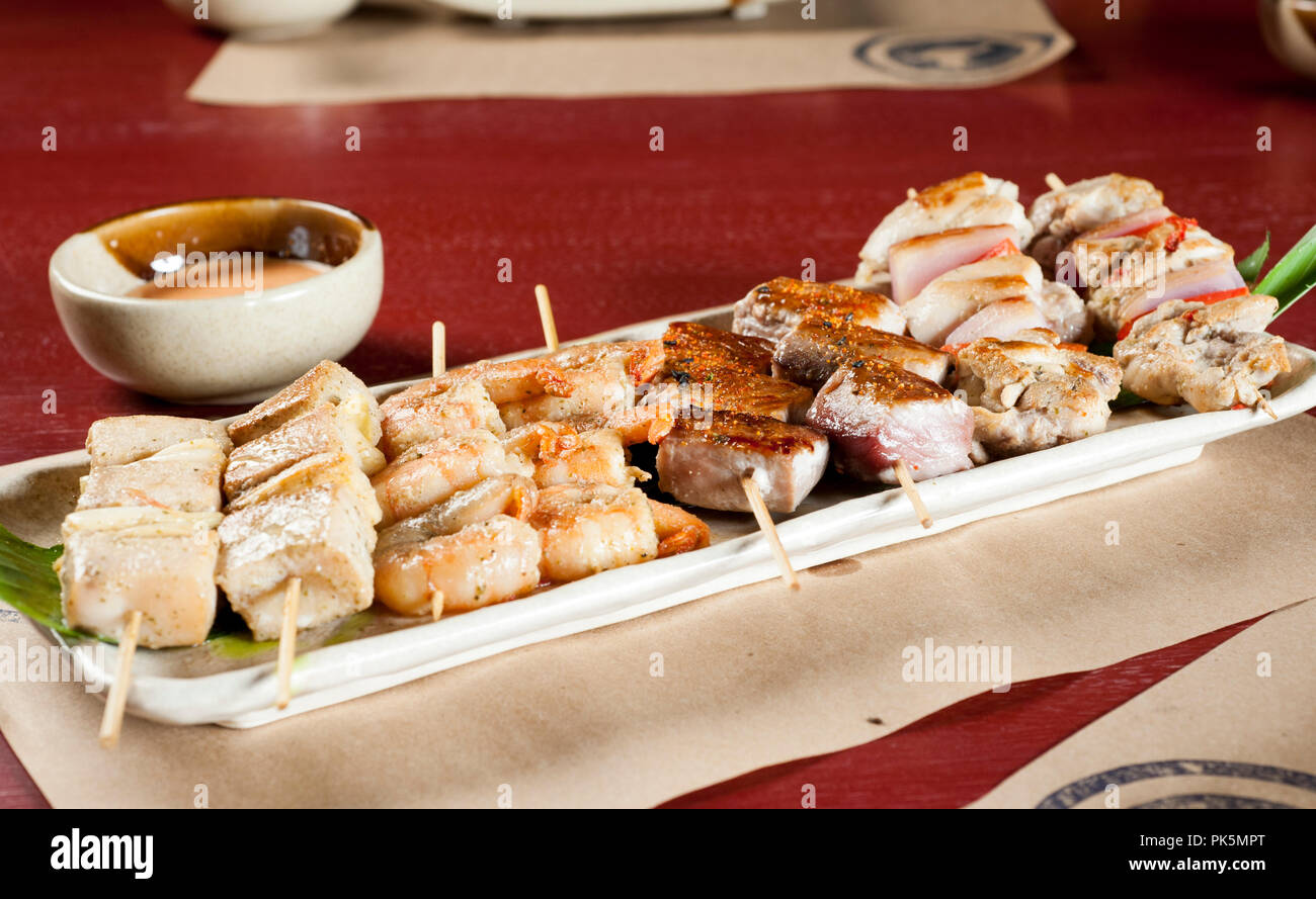 Mixed skewers, chicken meat, fish and cow Stock Photo - Alamy