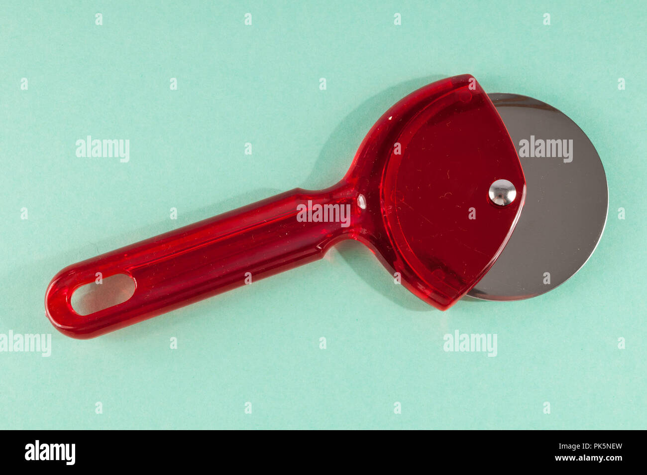 Picture of Plastic Red Pizza Cutter Slicer Knife Stock Photo - Alamy