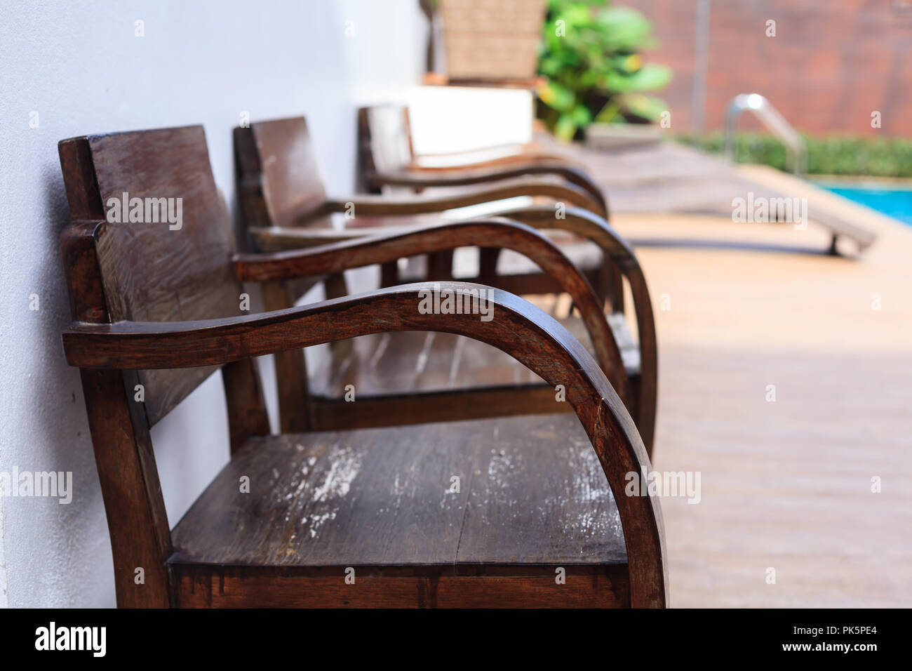 outdoor tropical, traditional pattern wooden chairs on white wall ...