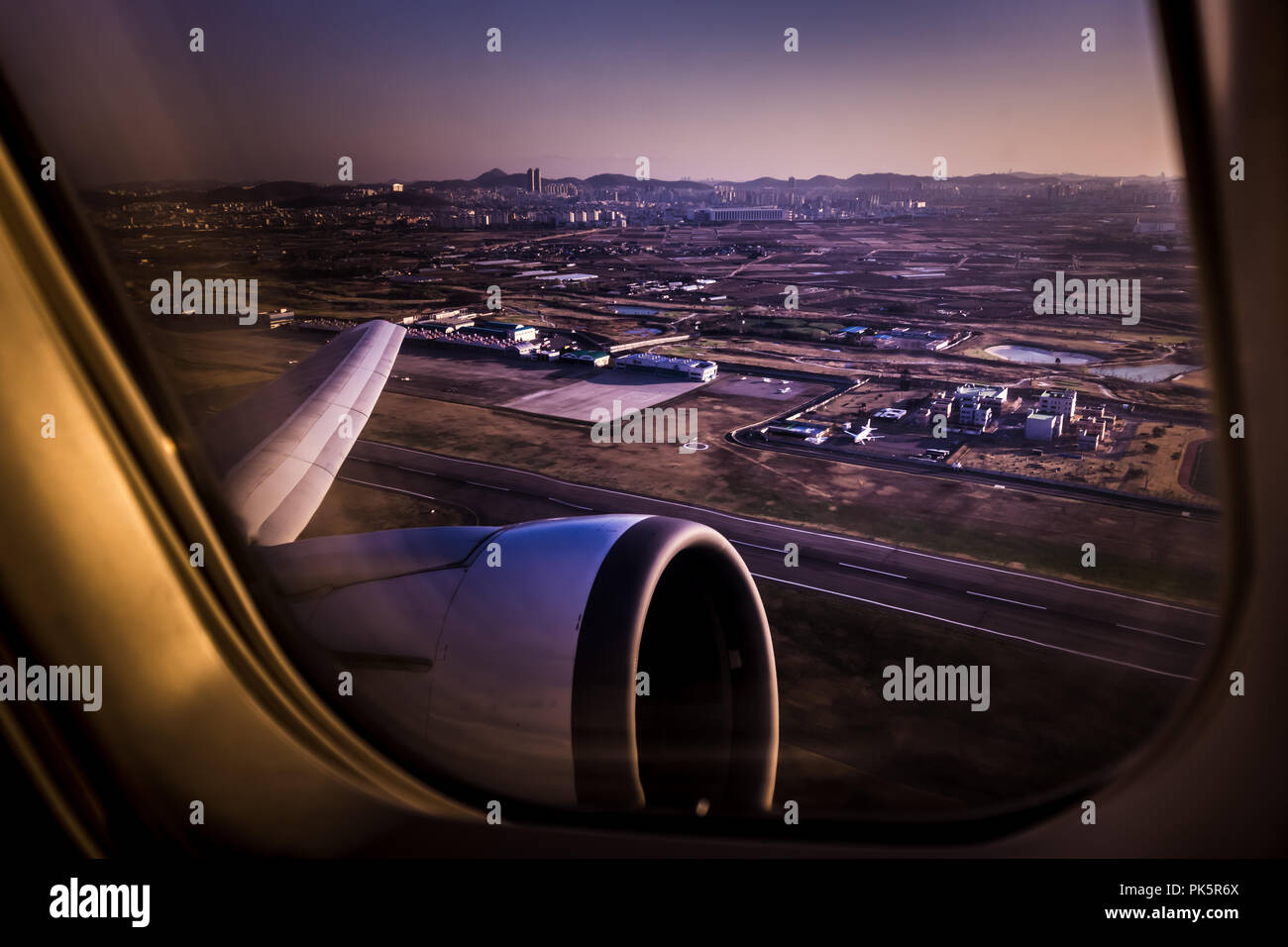 Beautiful aerial view through window of commercial airplane, part of ...