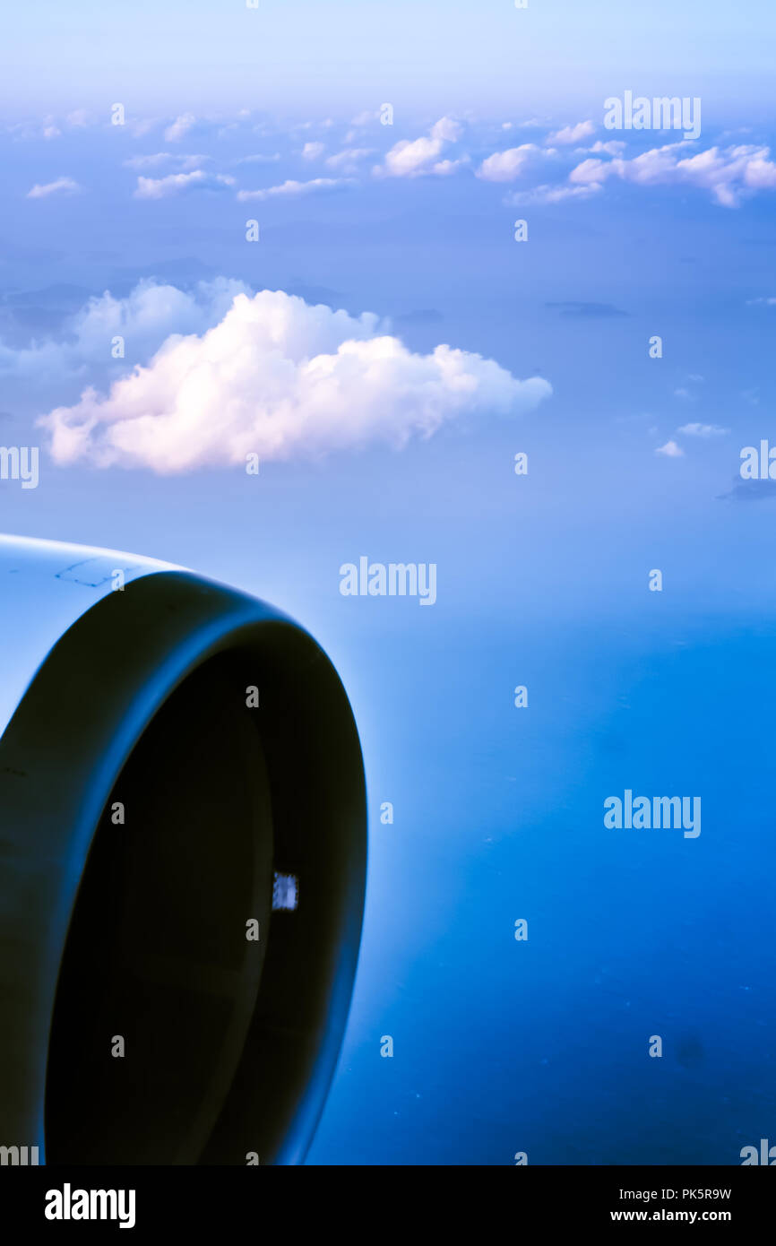 Beautiful aerial view through window of commercial airplane, part of ...