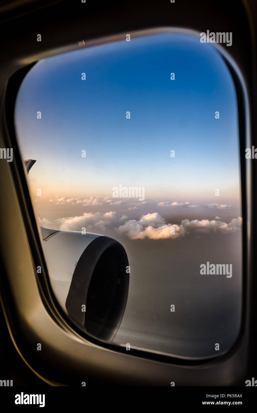 Beautiful aerial view through window of commercial airplane, part of ...