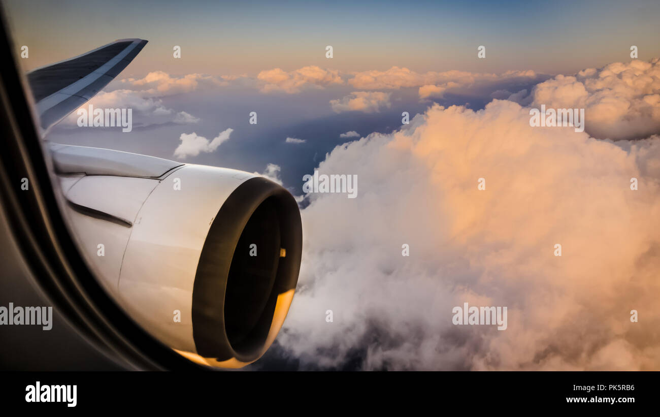 Beautiful aerial view through window of commercial airplane, part of ...
