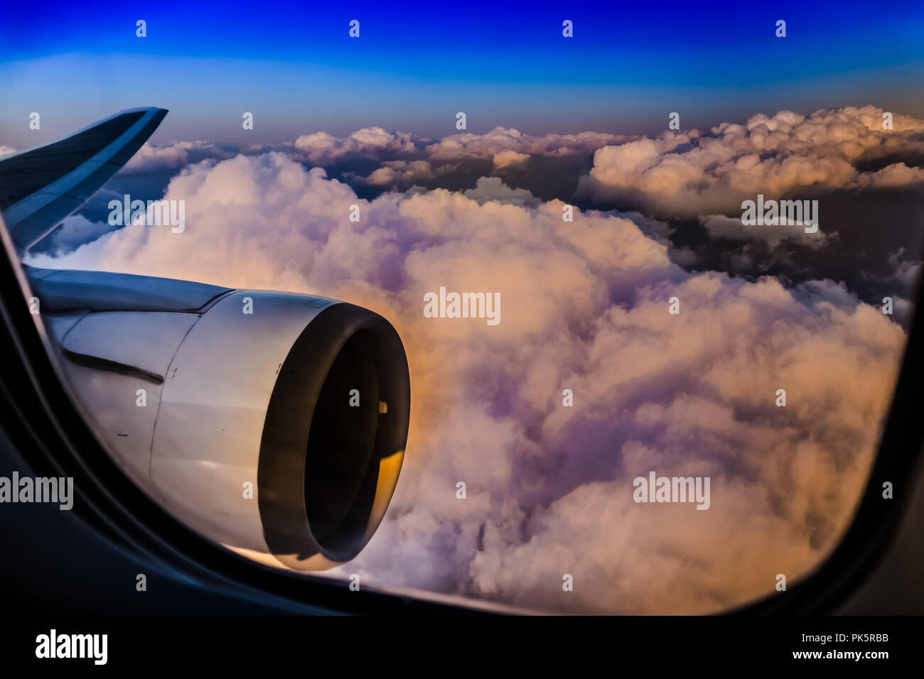 Beautiful aerial view through window of commercial airplane, part of ...