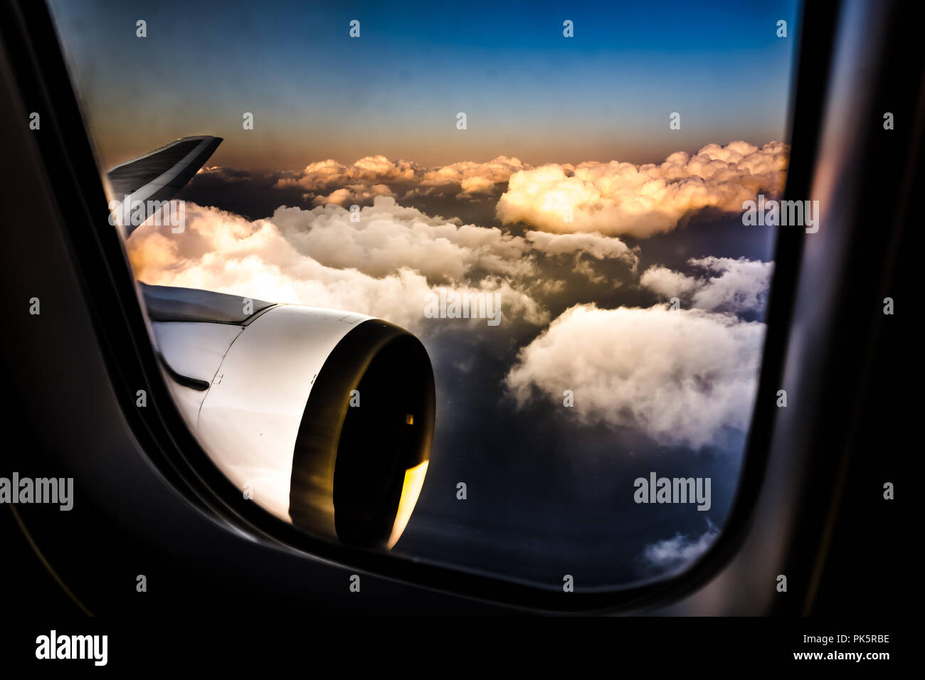Beautiful aerial view through window of commercial airplane, part of ...